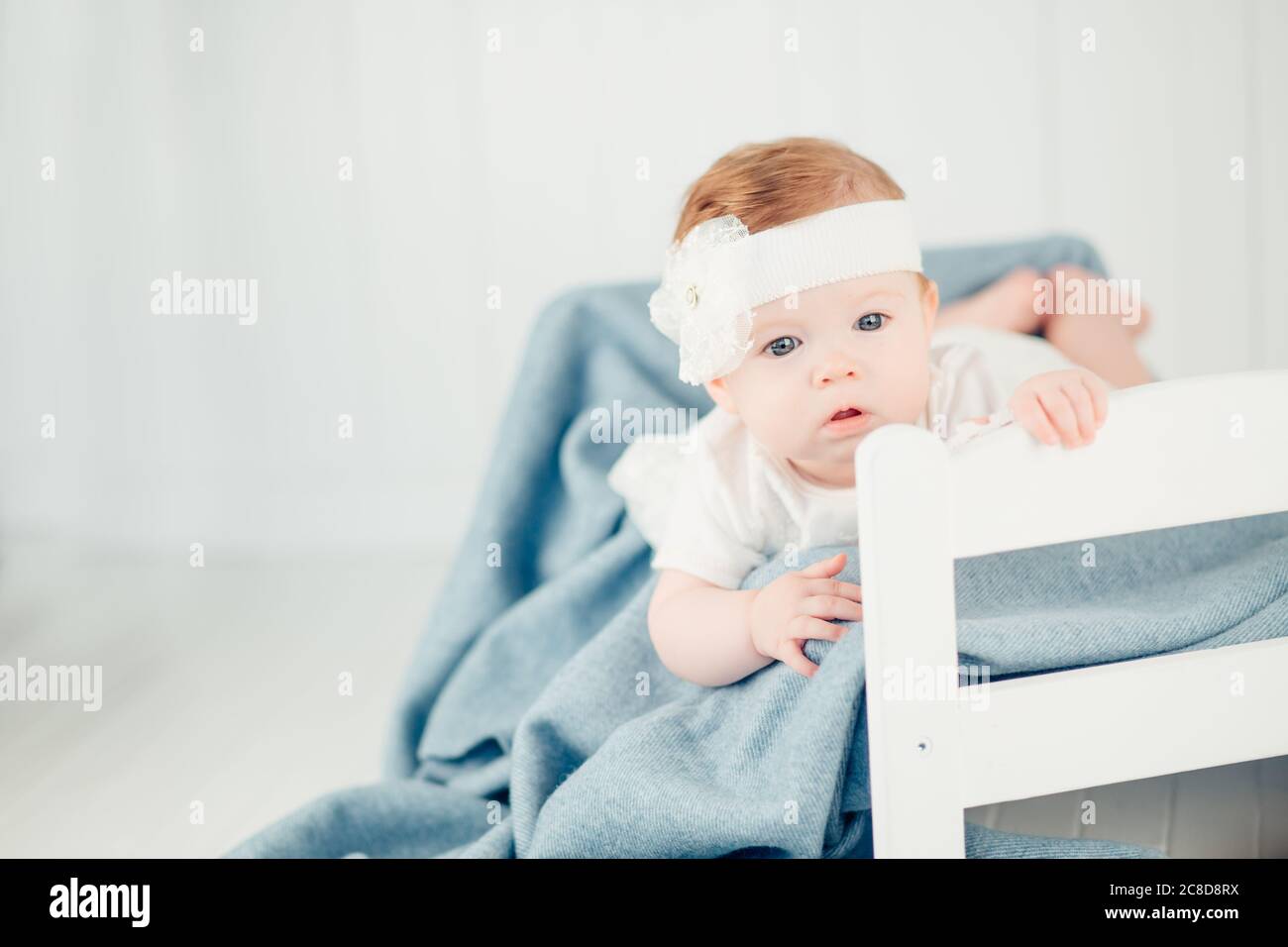 baby in bed. New born child under a blue knitted blanket.Bedding for ...