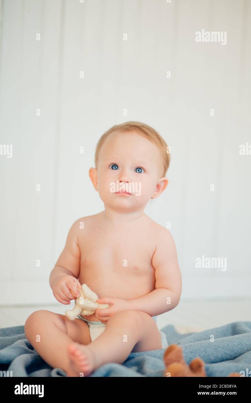 childhood, babyhood and people concept - happy little baby boy or girl ...