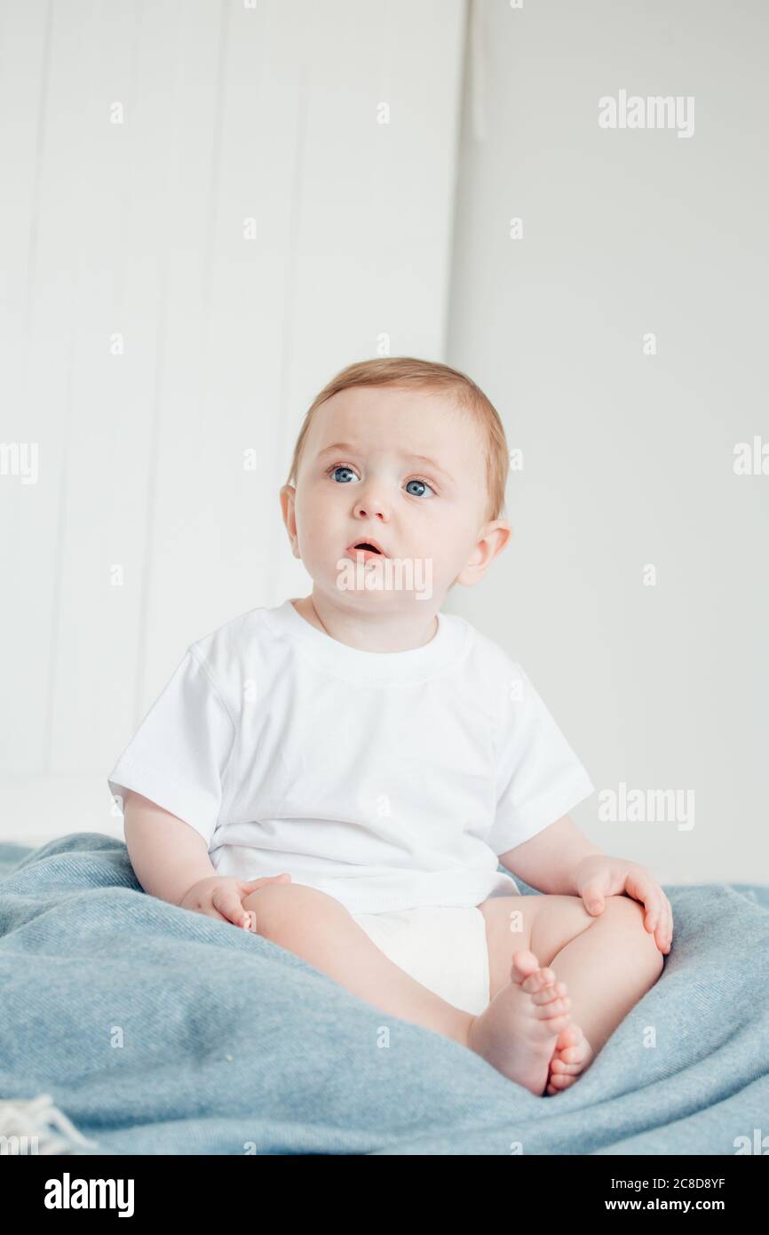 childhood, babyhood and people concept - happy little baby boy or girl ...