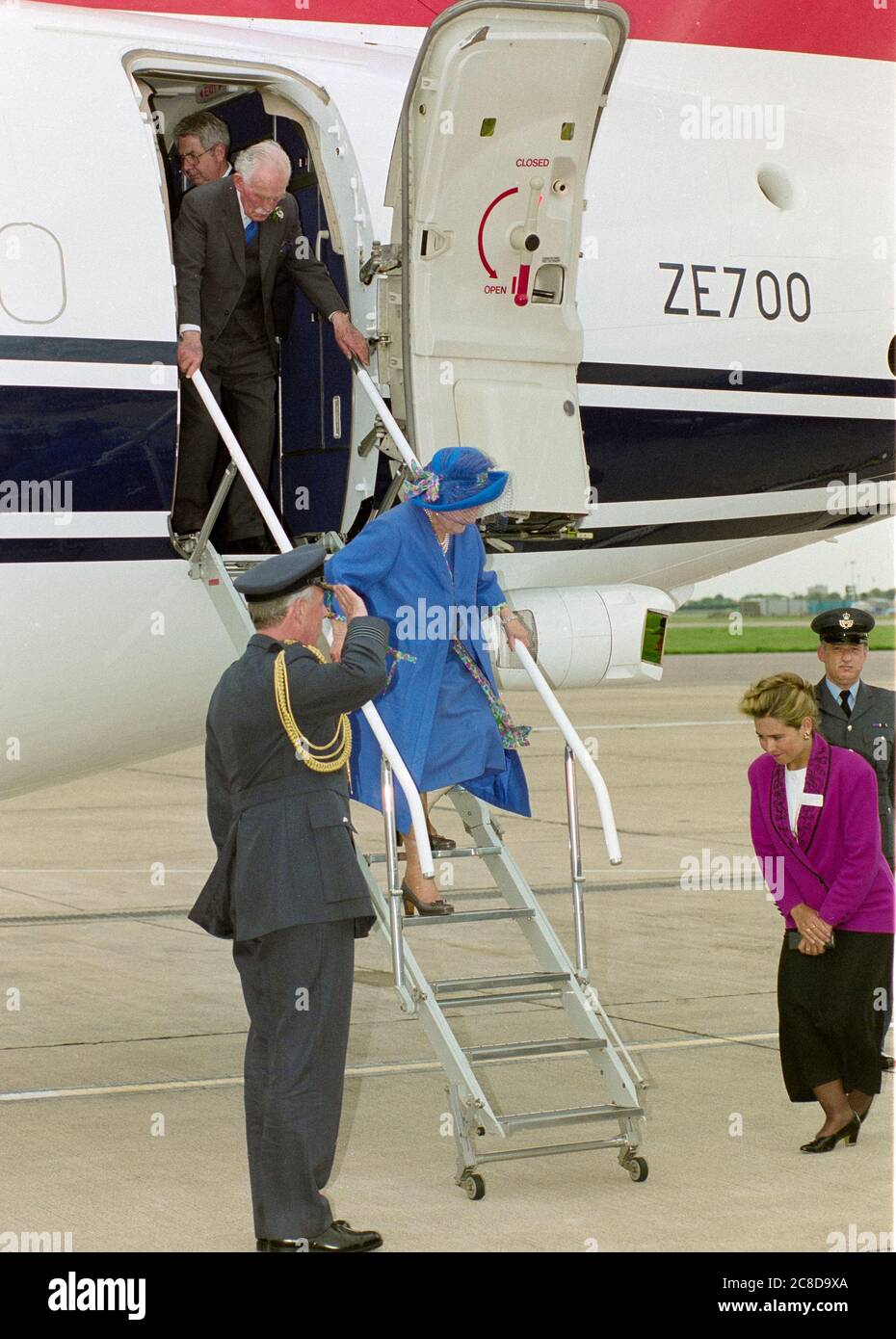 HM Queen Elizabeth The Queen Mother returning London with her pet ...