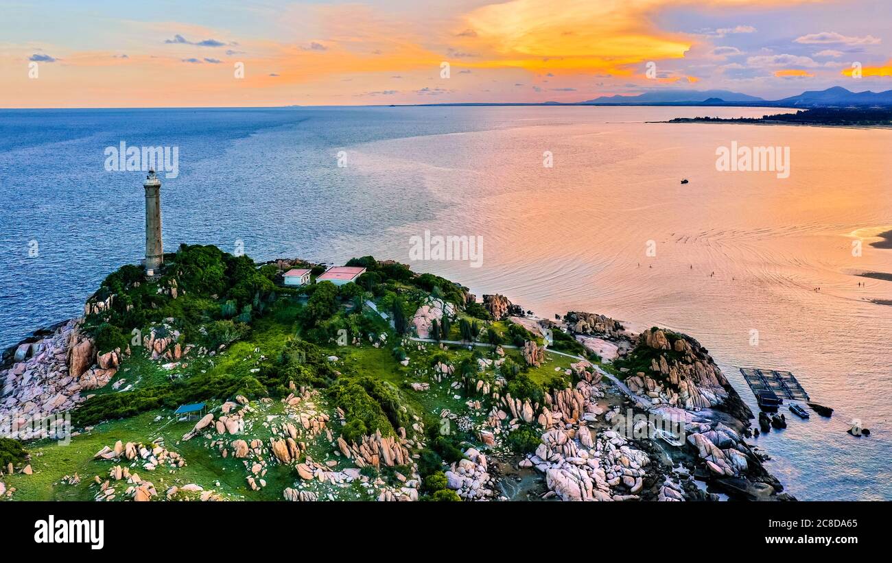 Ke Ga lighthouse at sunset in Vietnam. Ocean view landscape. Drone ...