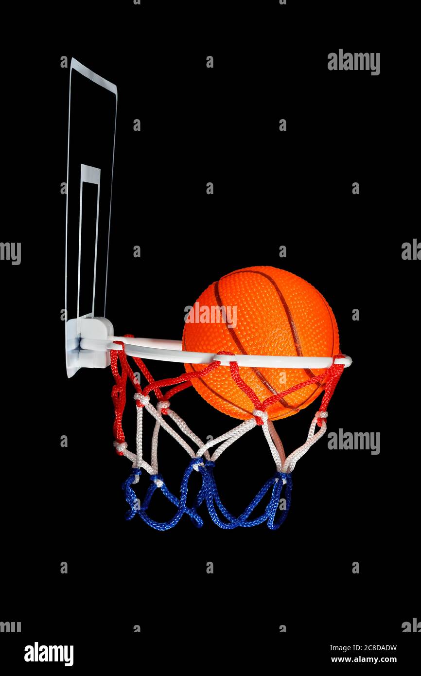 basketball going through the hoop isolated on black Stock Photo - Alamy