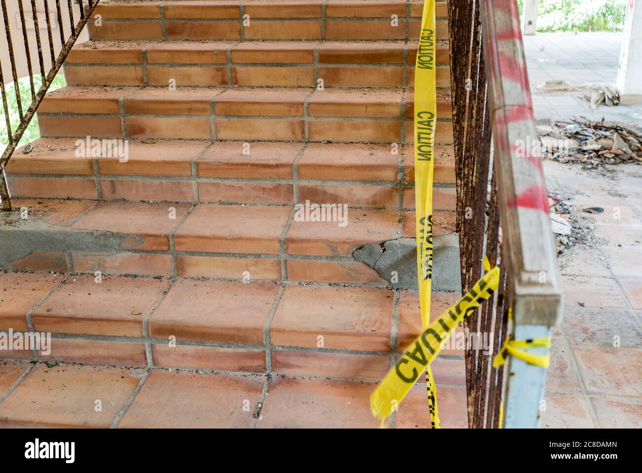 Damage staircase with yellow caution rope Stock Photo - Alamy