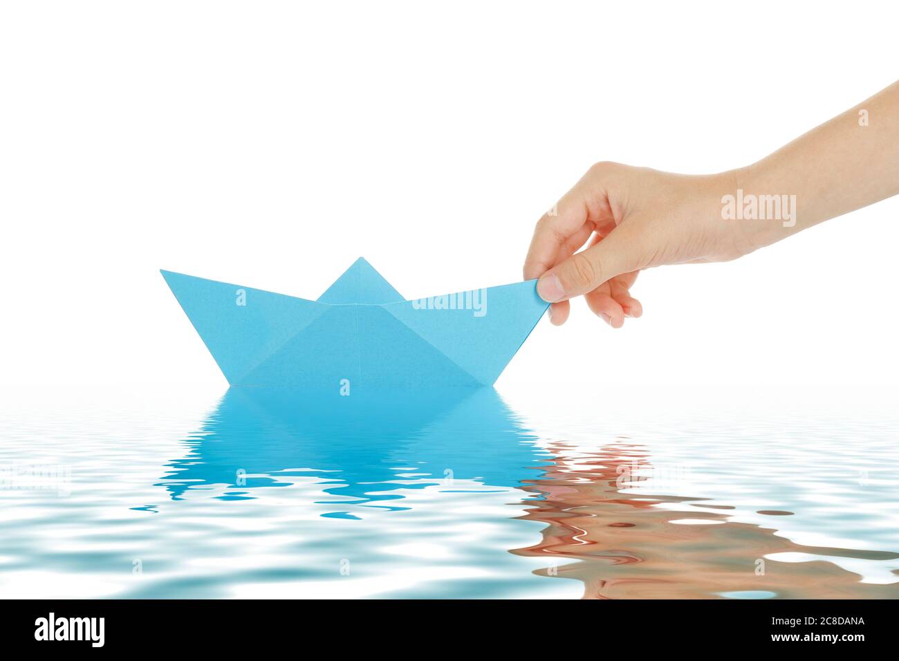 boy's hand with blue paper boat isolated on white Stock Photo - Alamy