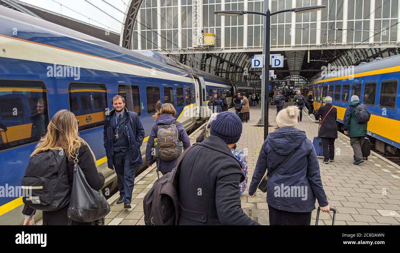 Passengers disembark from the Eurostar high speed train in Amsterdam ...