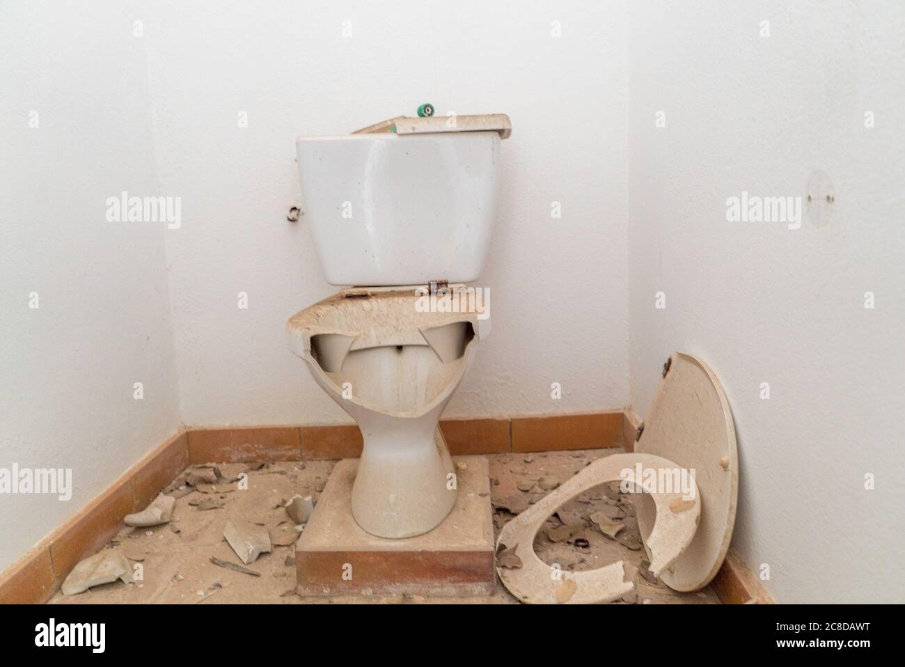 Damage worn down toilet bowl Stock Photo - Alamy