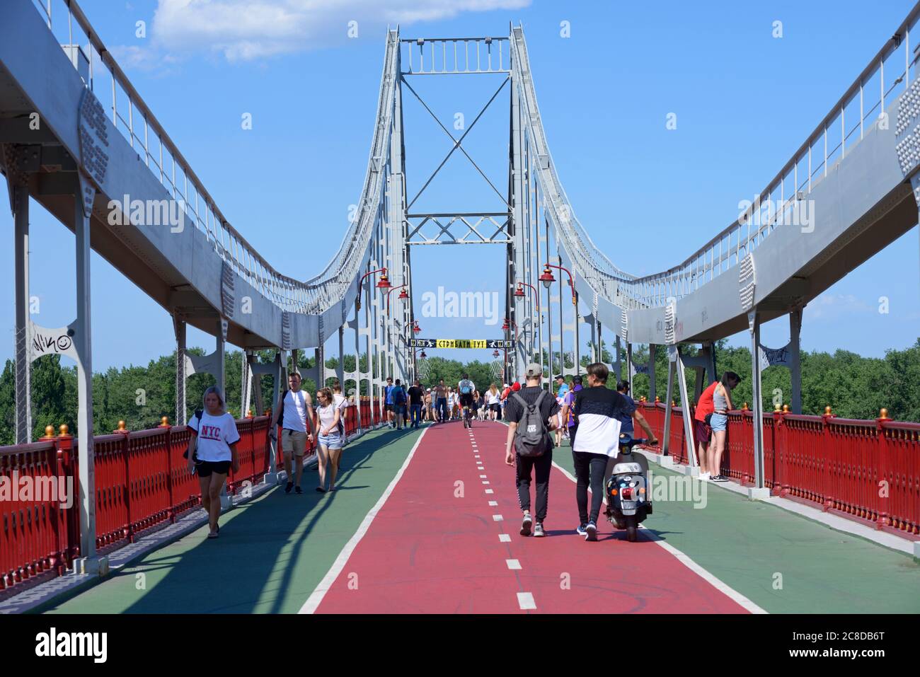 People walking on the Pedestrian bridge Stock Photo - Alamy