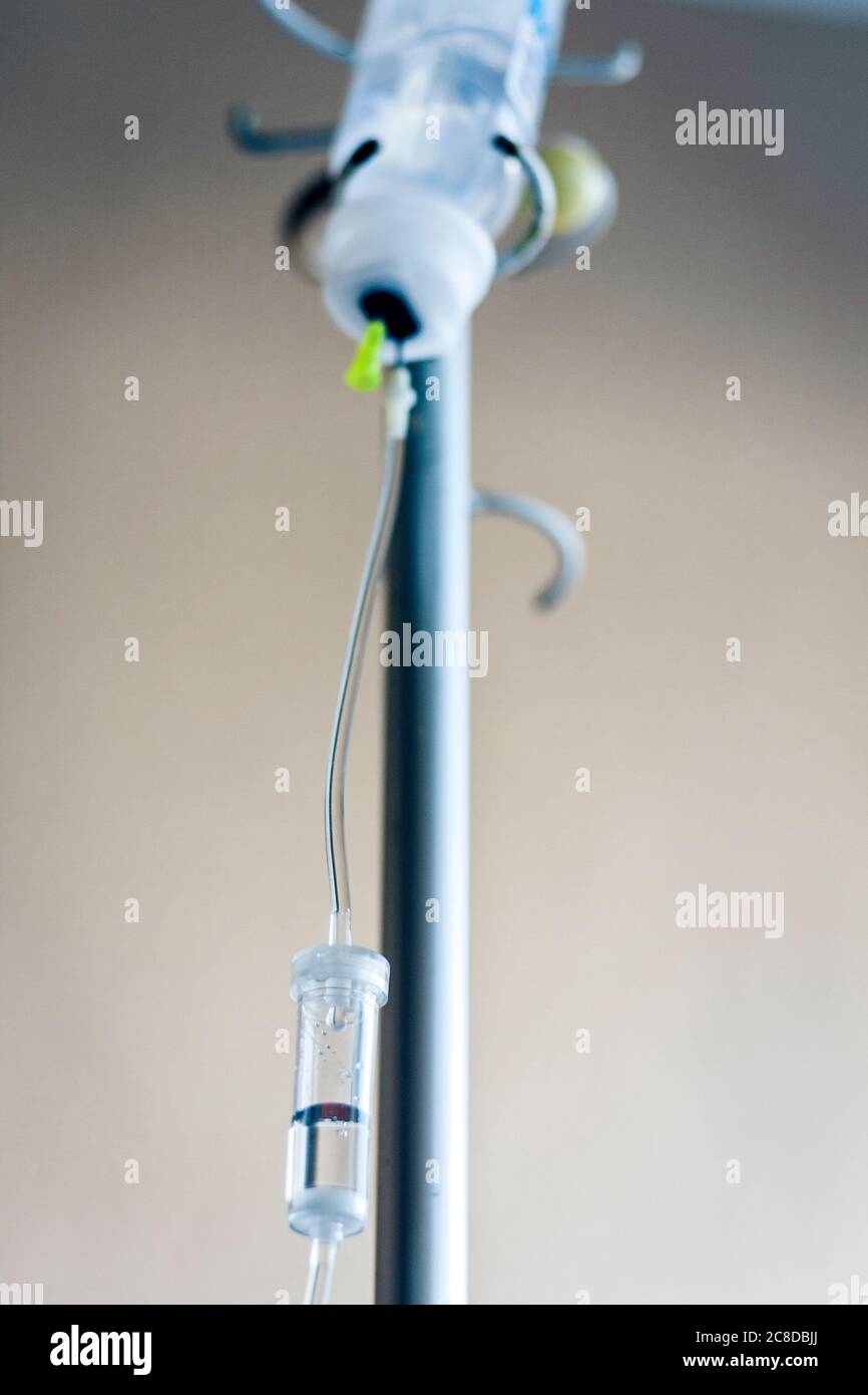 Close-up bottle of medicine on dropper system in the operating room ...