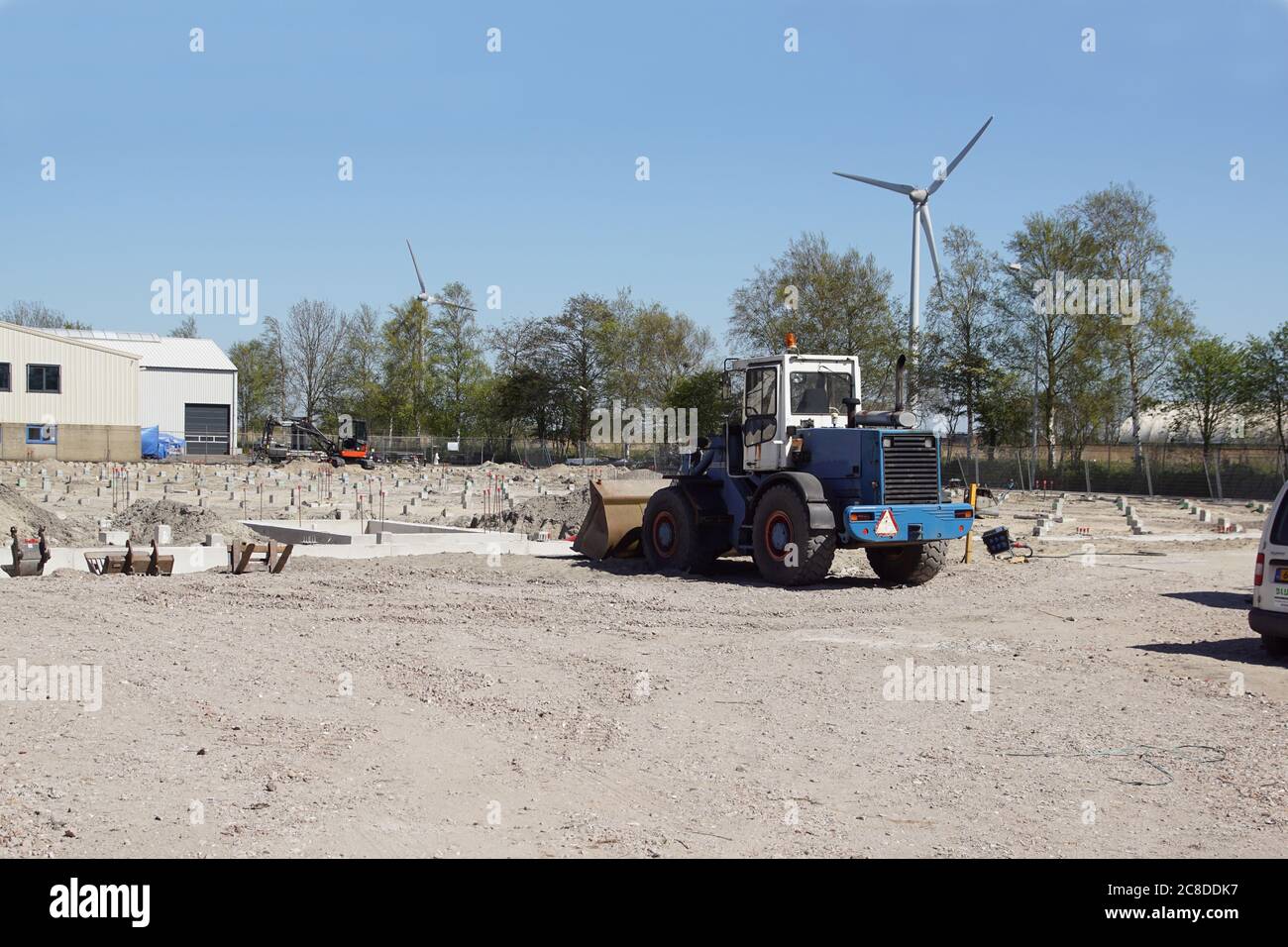 Square precast concrete piles at a construction site. Driven to soil ...