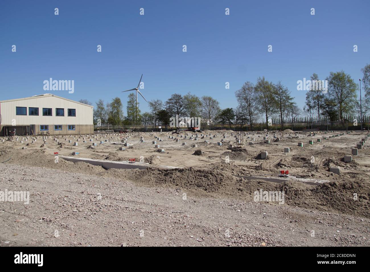 Square precast concrete piles at a construction site. Driven to soil ...