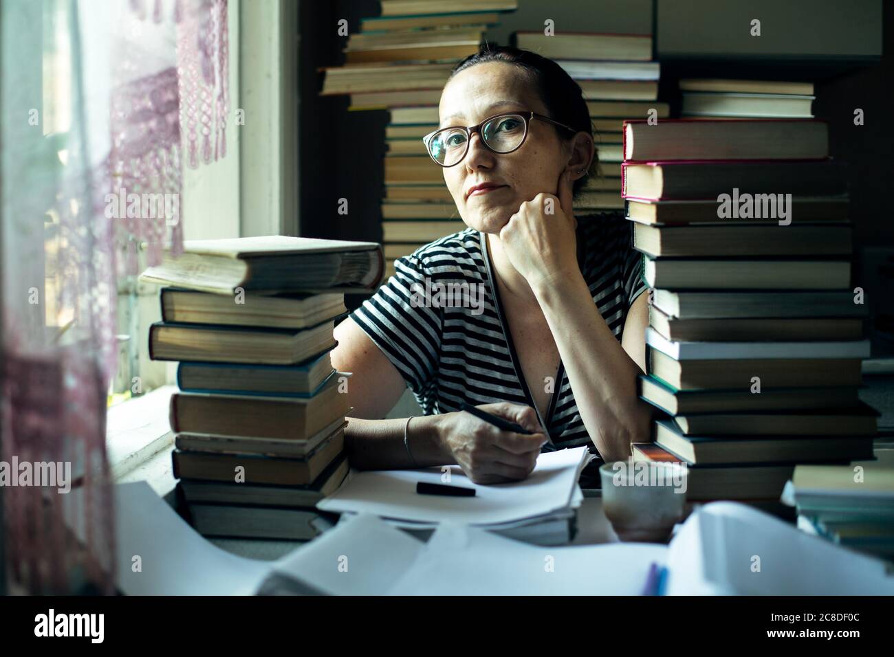 Focused woman writes in hi-res stock photography and images - Alamy