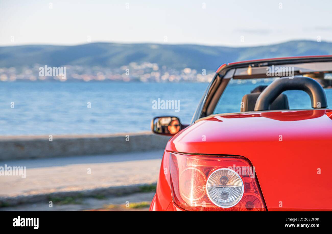 Car on the seashore in the evening Stock Photo - Alamy