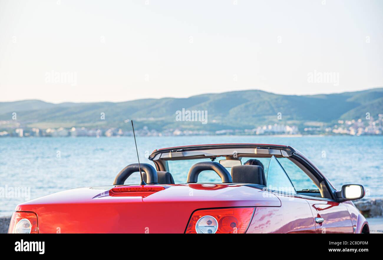 Car on the seashore in the evening Stock Photo - Alamy