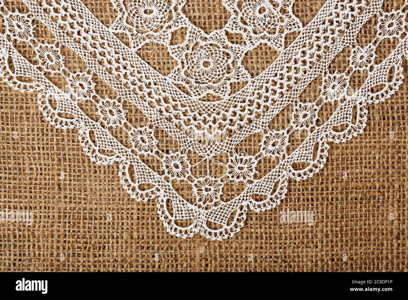 handmade doily on burlap for backgrounds Stock Photo - Alamy