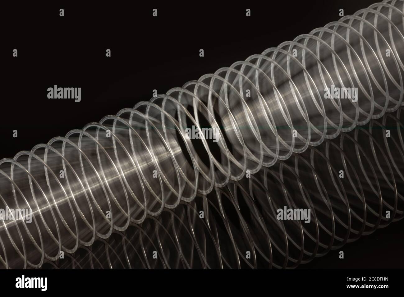 Metal silver spring, bouncing. Motion blur Stock Photo - Alamy