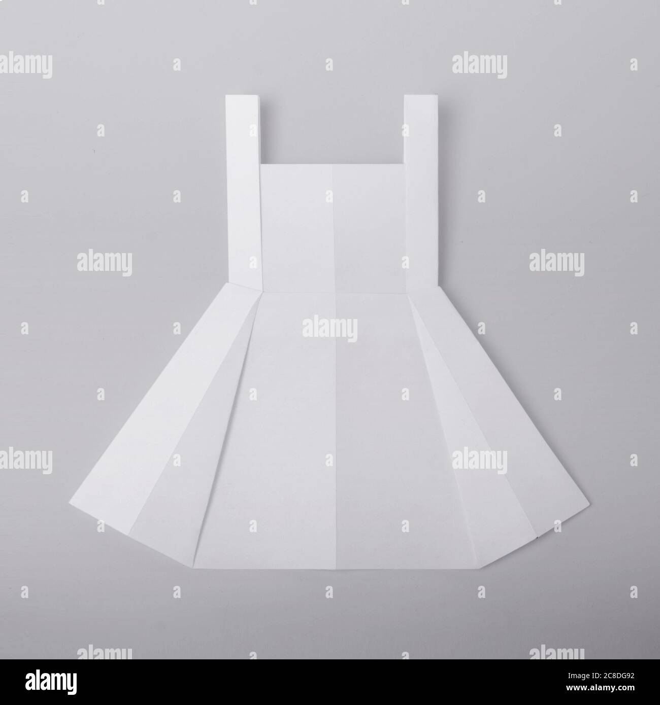 White origami paper style template dress on gray Stock Photo - Alamy