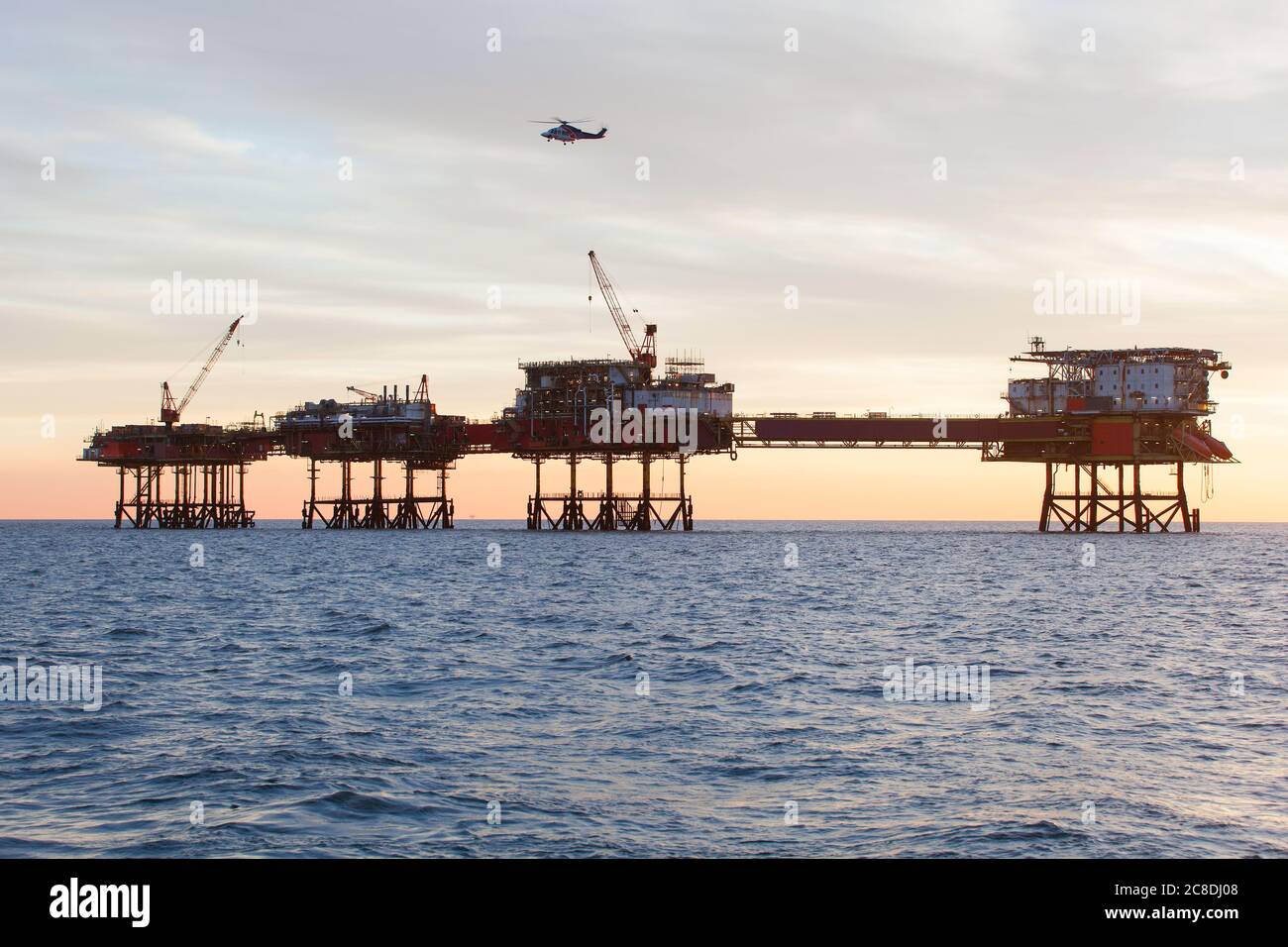 Offshore oil platform at sunset time Stock Photo - Alamy