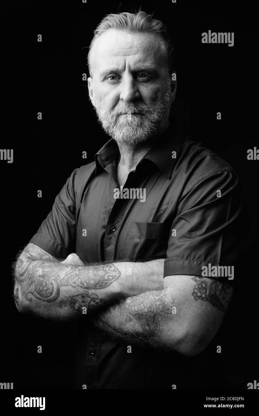 Mature handsome bearded man in black and white Stock Photo - Alamy