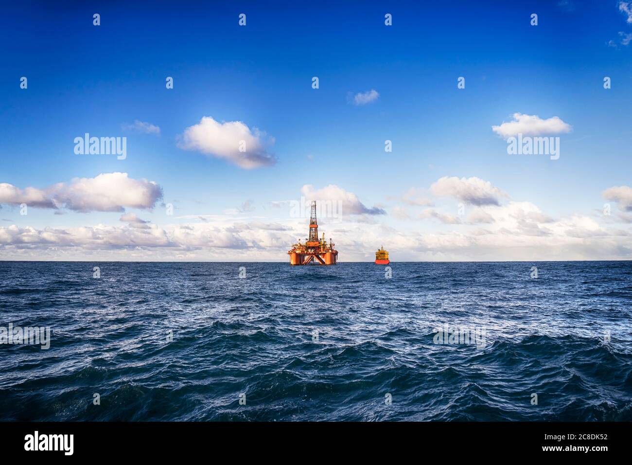 Drilling rig and supply ship Stock Photo - Alamy