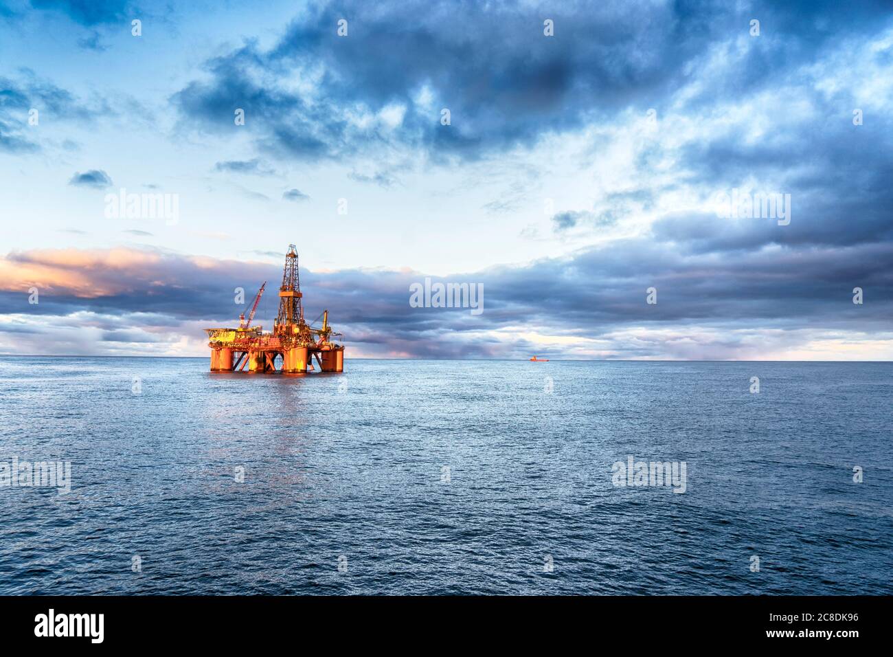 OIl rig at sunnset time Stock Photo - Alamy