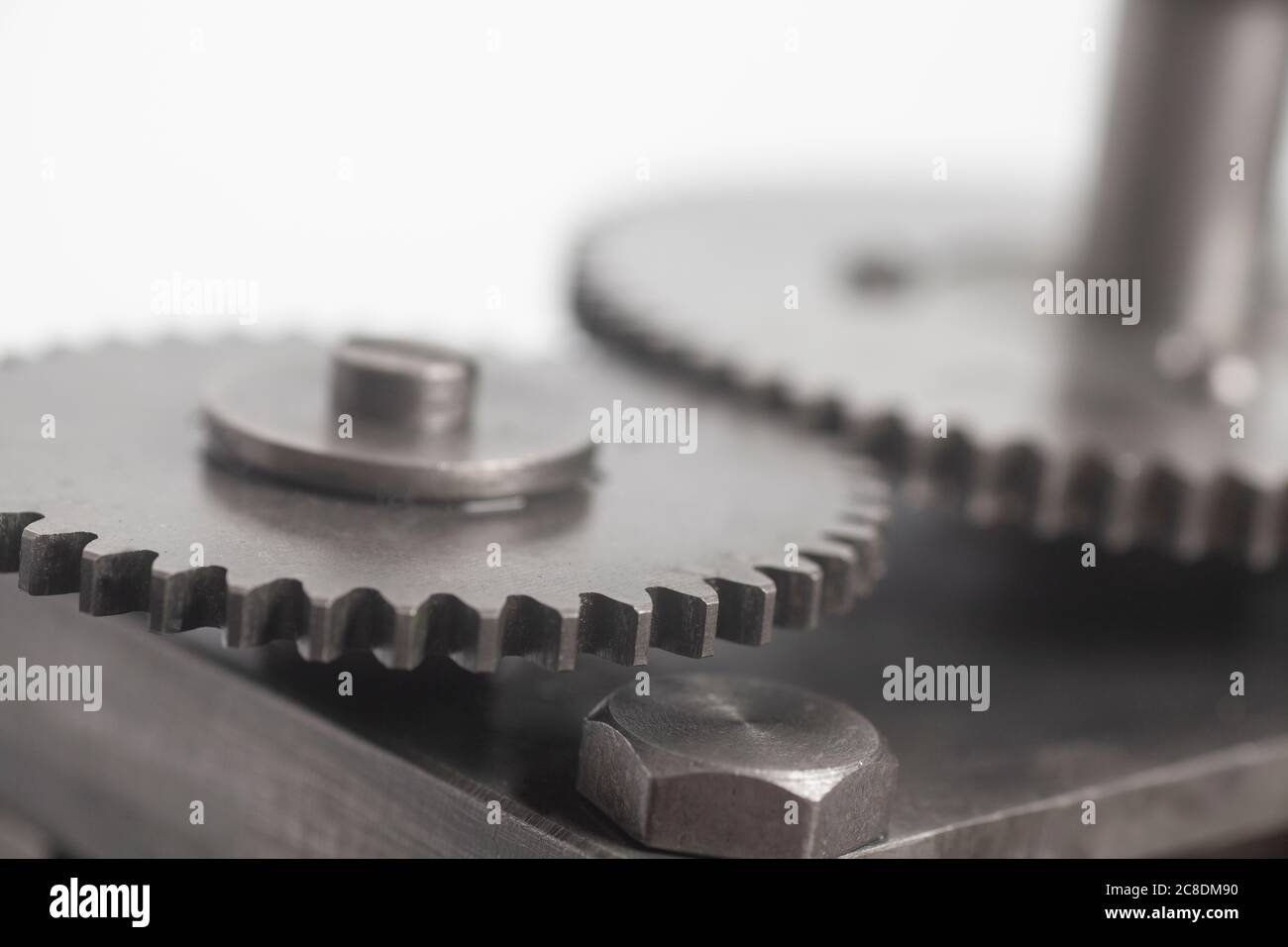 Machine gear, metal cogwheels, on white Stock Photo - Alamy