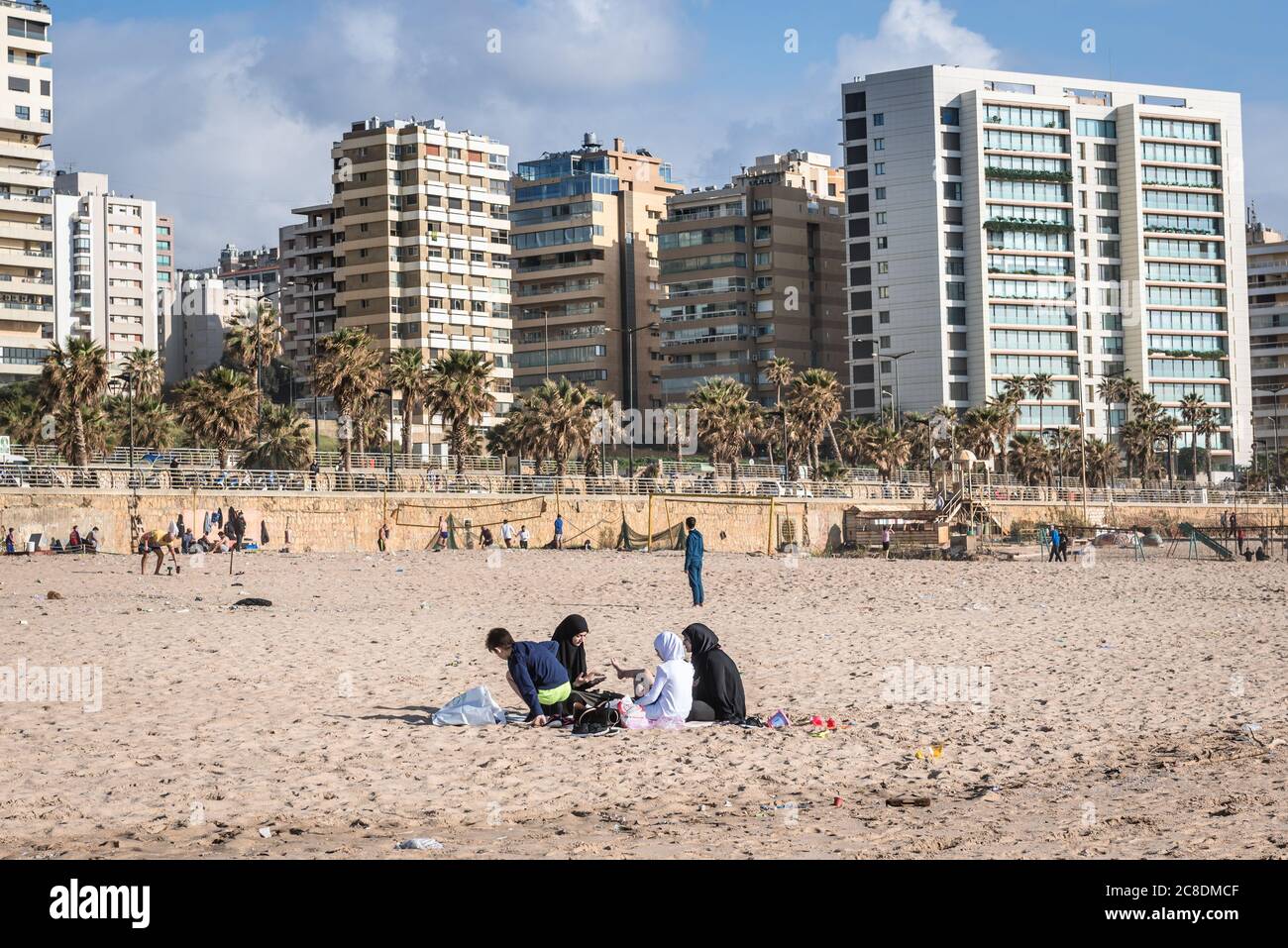 People on Ramlet al Baida public beach situated along the southern end ...