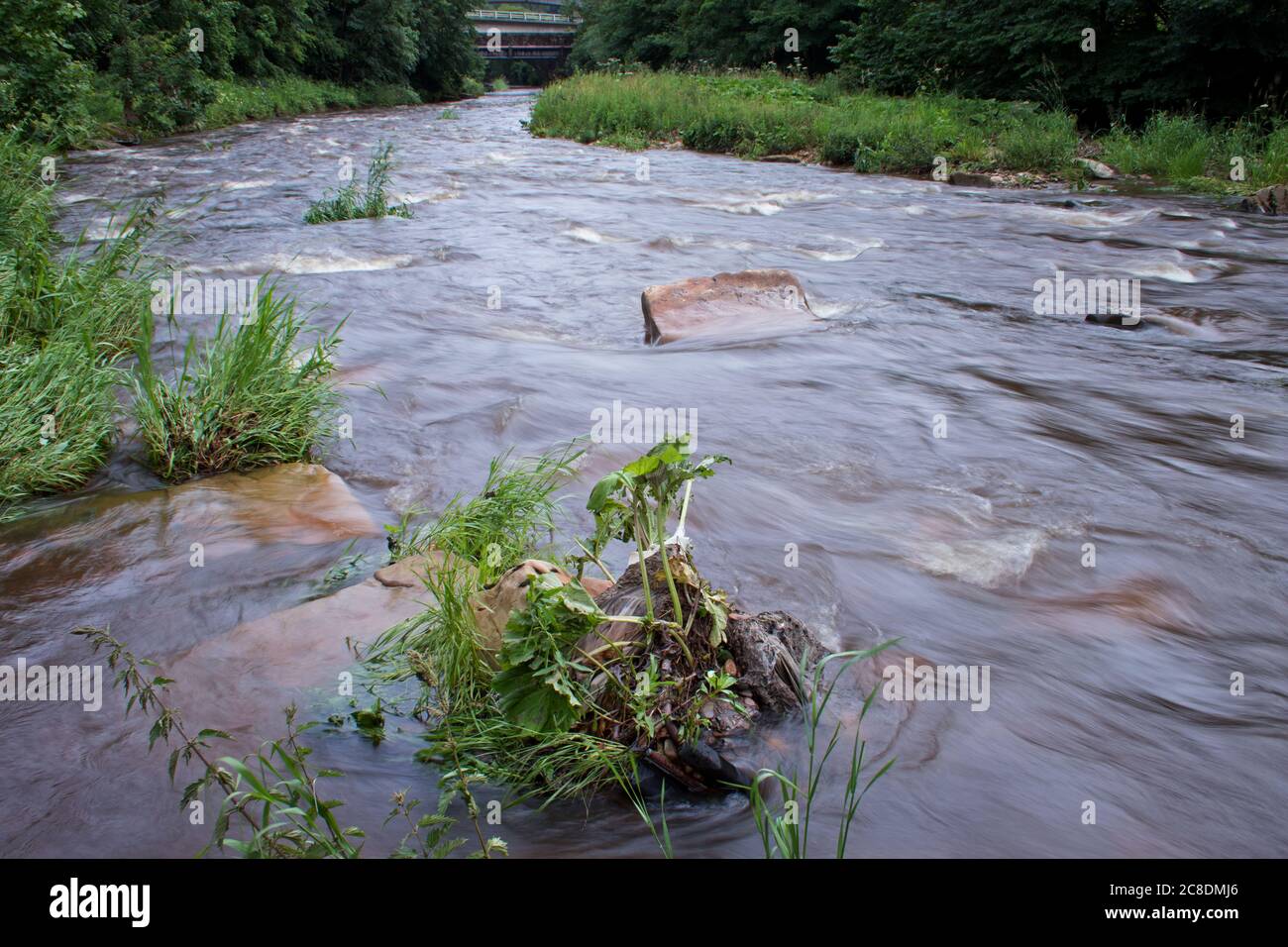 Pendle water after a rainy period, with water lapping on the bank of ...