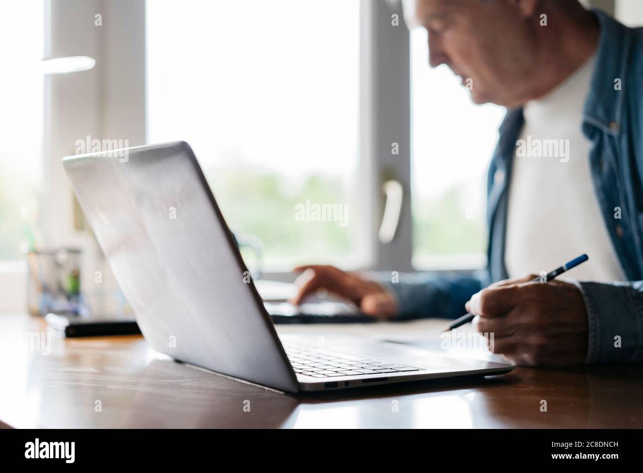 Business man holding calculator hi-res stock photography and images - Alamy