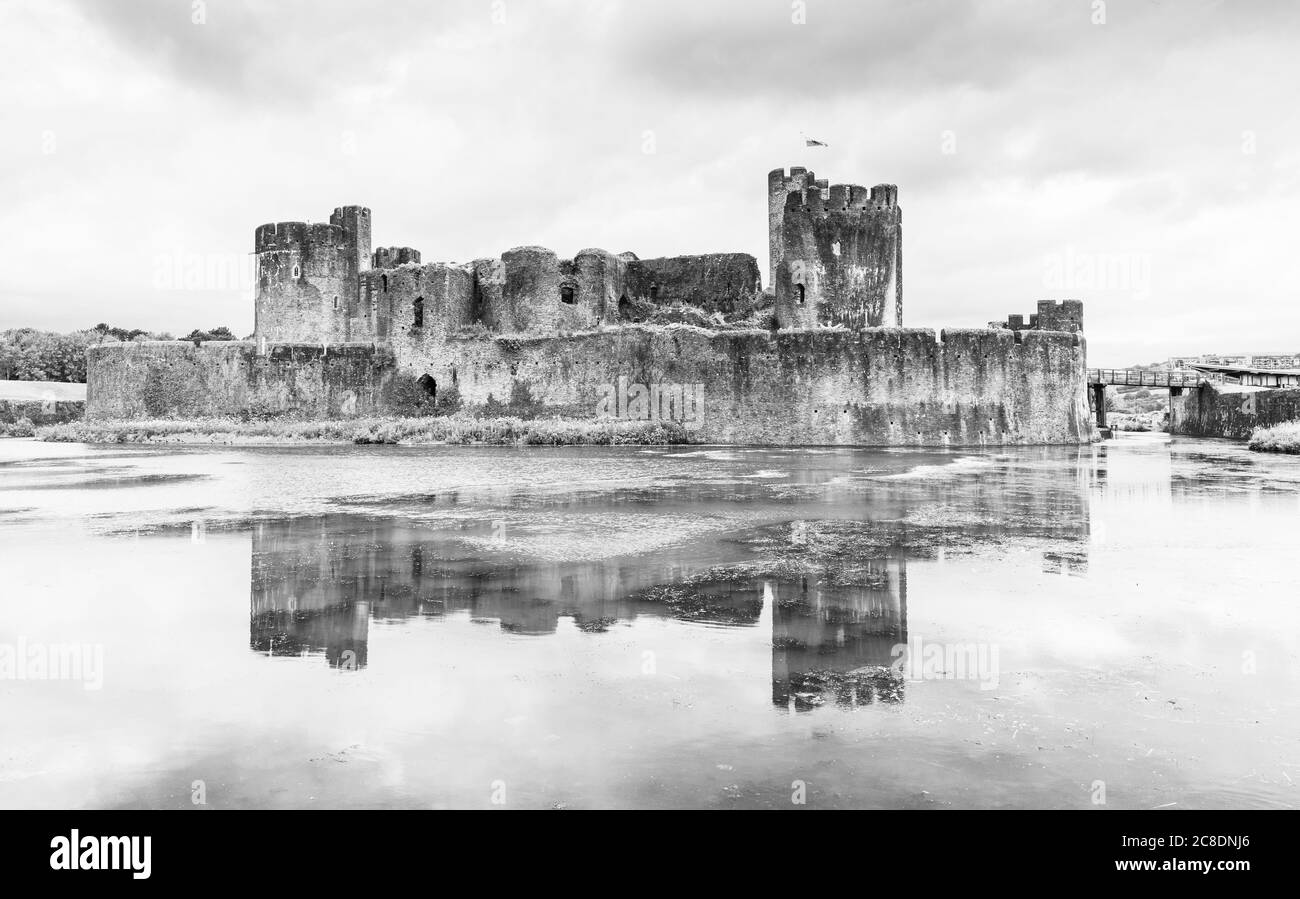 Caerphilly Castle. Wales reflecting in the moat Stock Photo - Alamy