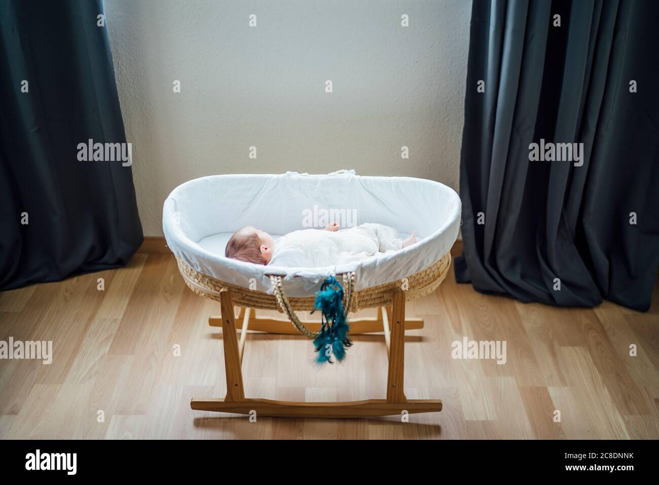 Baby boy lying in crib at home Stock Photo - Alamy