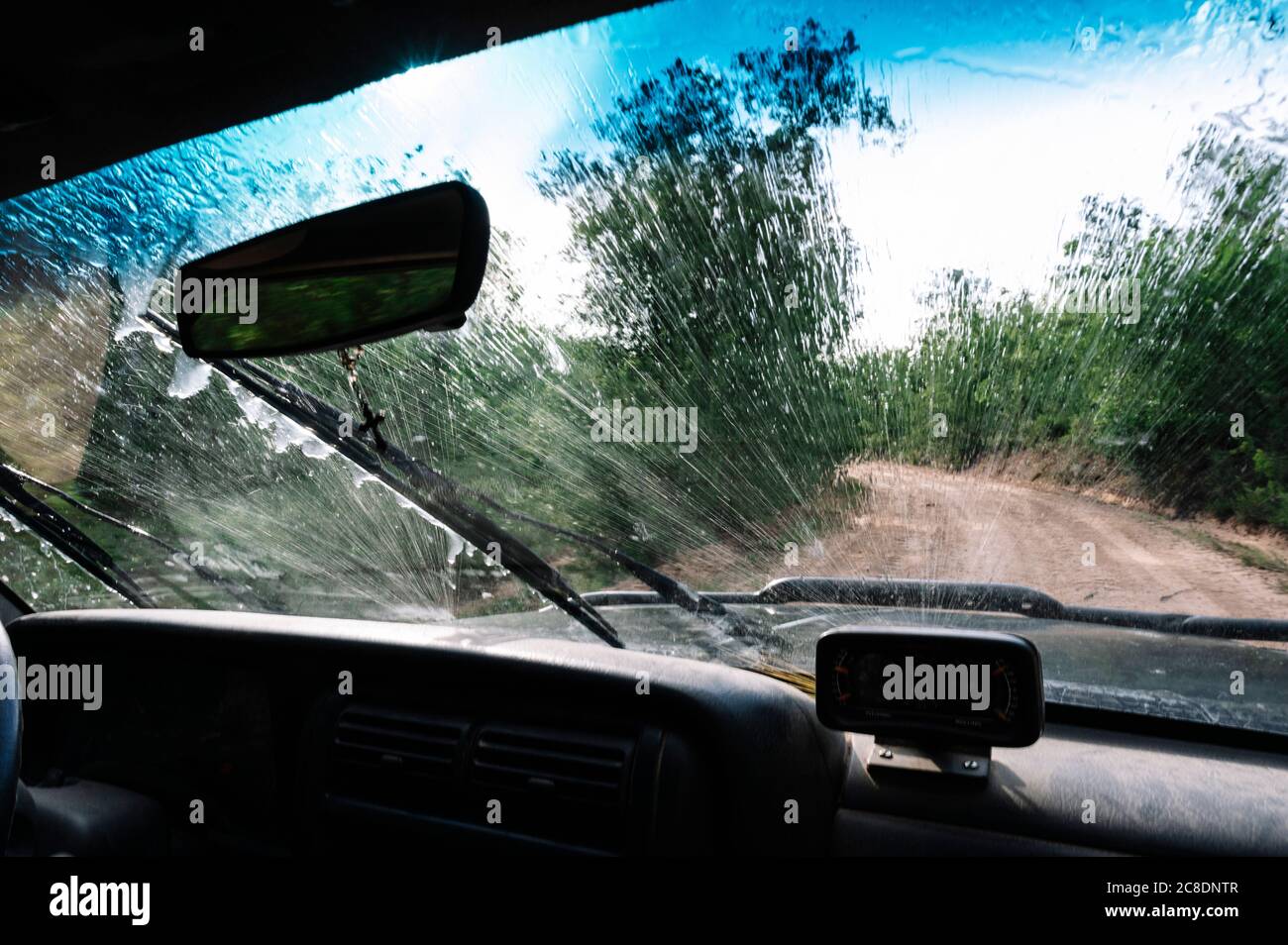 Splashing water on vehicle windshield during road trip Stock Photo - Alamy