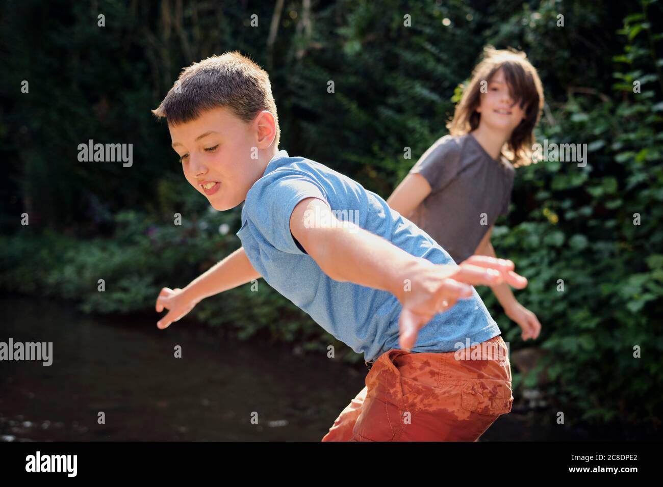 Two boys playing forest hi-res stock photography and images - Alamy