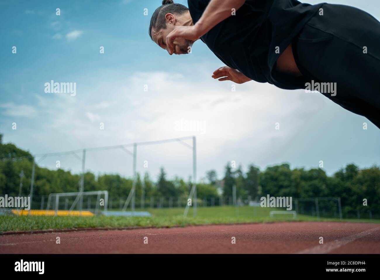 young athlete push up and jump at stadium outdoor Stock Photo - Alamy
