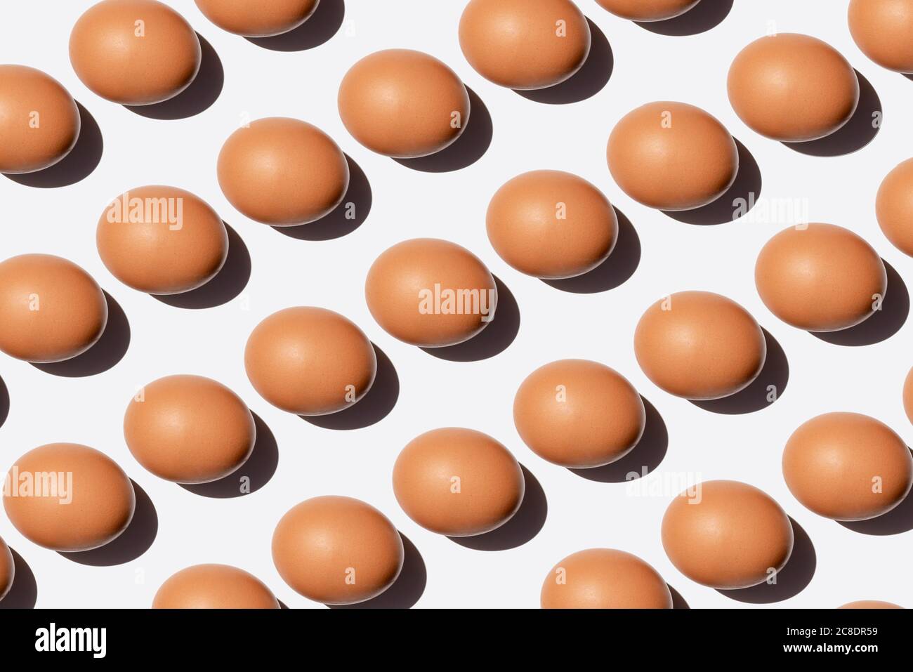 Pattern of chicken eggs against white background Stock Photo - Alamy