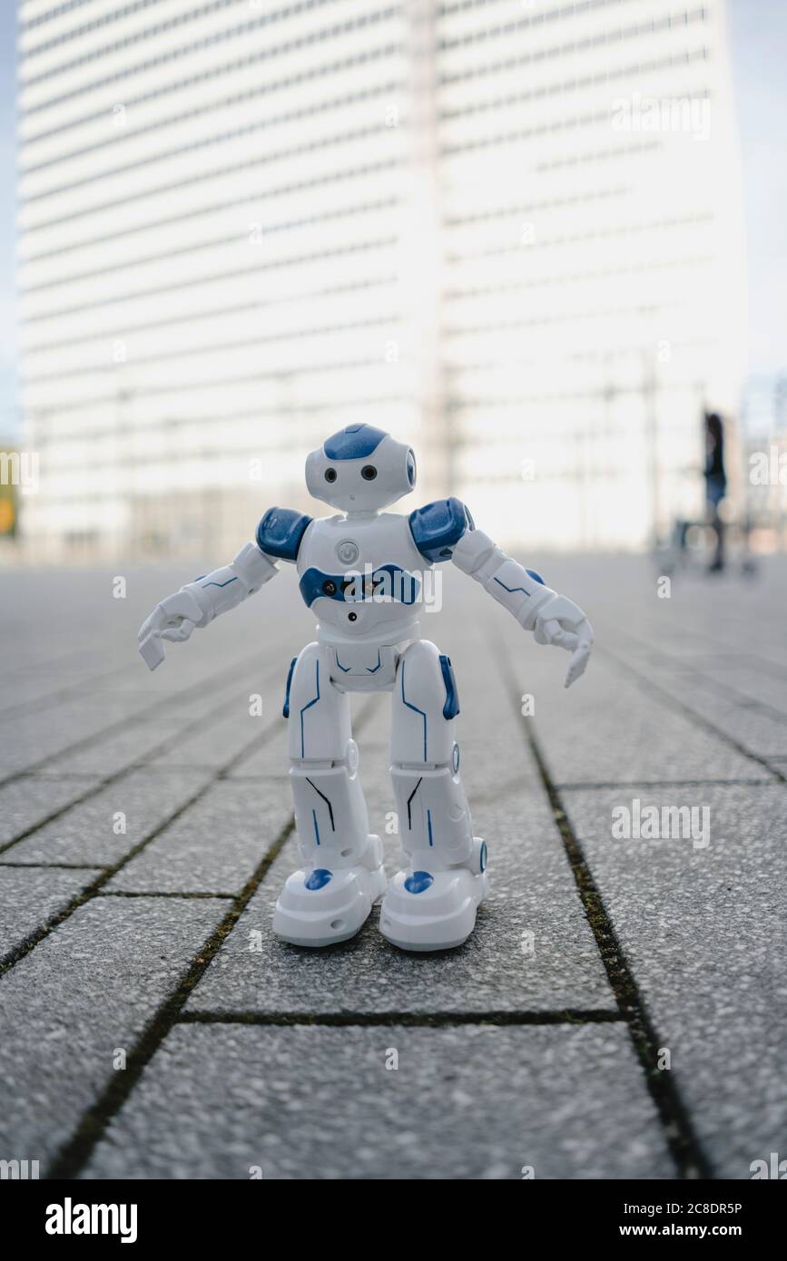 Mini robot on a square in the city Stock Photo - Alamy