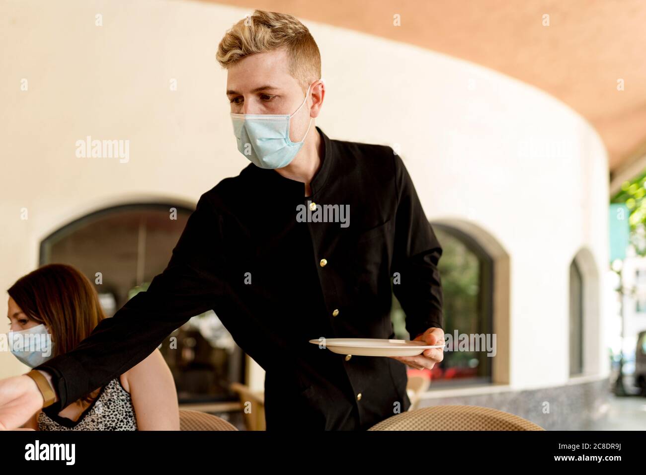 Waiter wearing uniform hi-res stock photography and images - Alamy