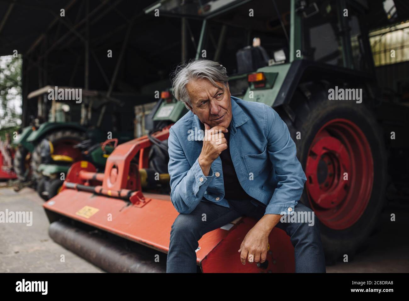 Farmer sitting in barn hi-res stock photography and images - Alamy