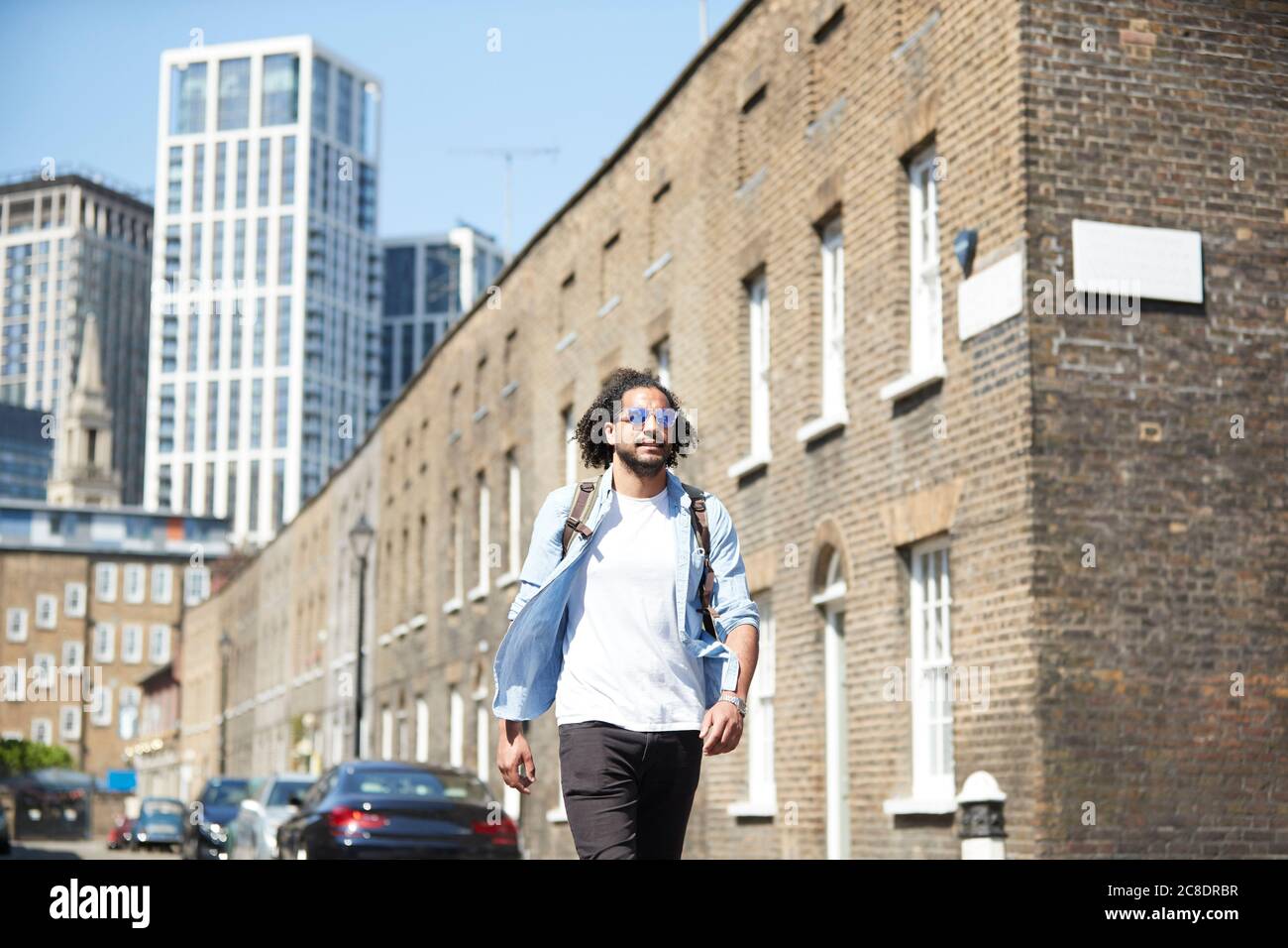 Man walking london street hi-res stock photography and images - Alamy