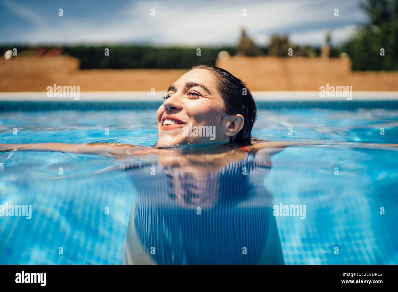 Woman in swimming pool hi-res stock photography and images - Alamy
