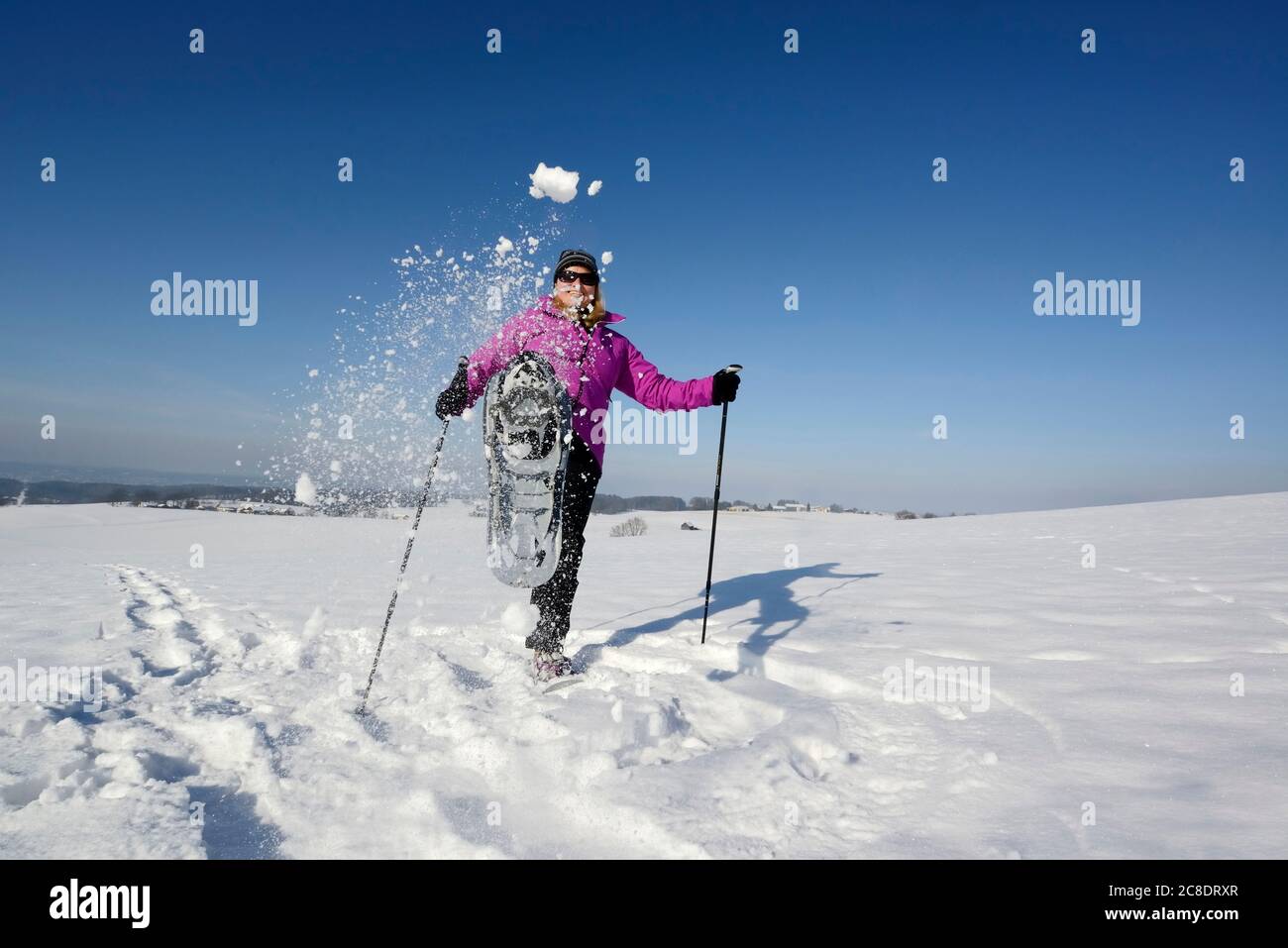 Woman kicking snow camera hi-res stock photography and images - Alamy