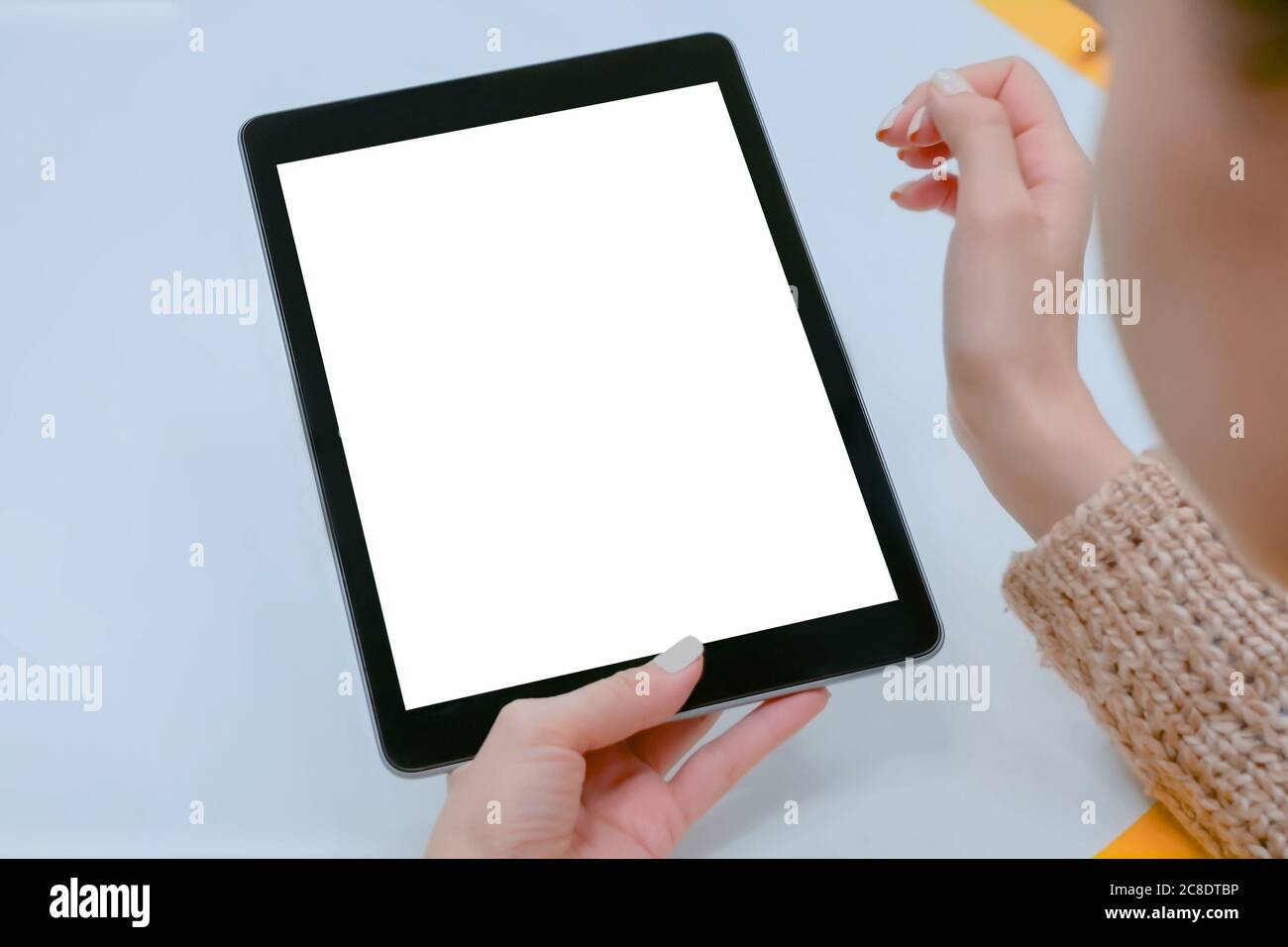 Over shoulder closeup view: woman hands holding digital tablet computer ...