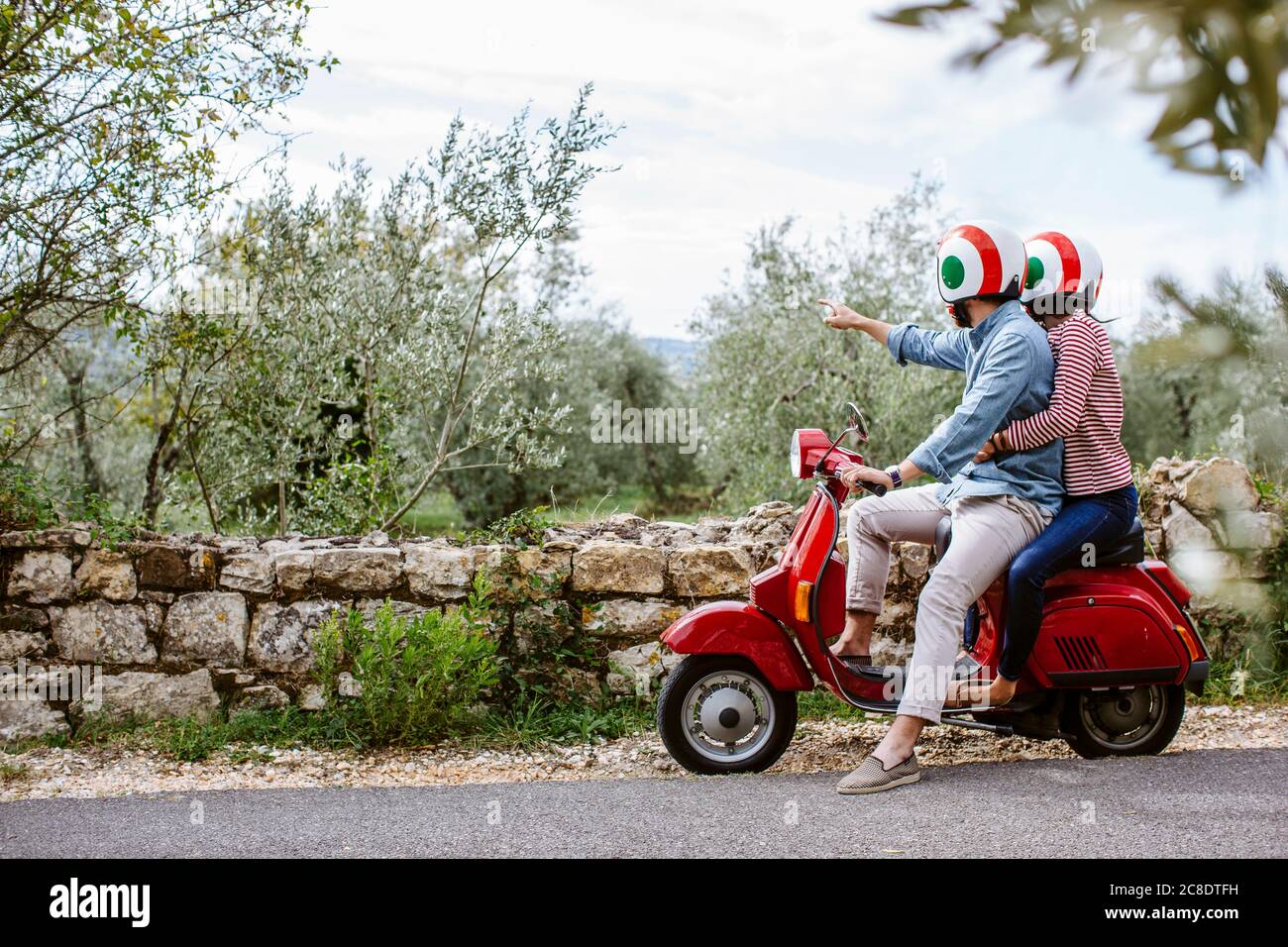Young couple exploring Tuscany on Vespa, Italy Stock Photo - Alamy