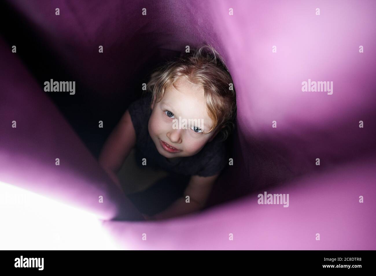 Girl in hiding hi-res stock photography and images - Alamy