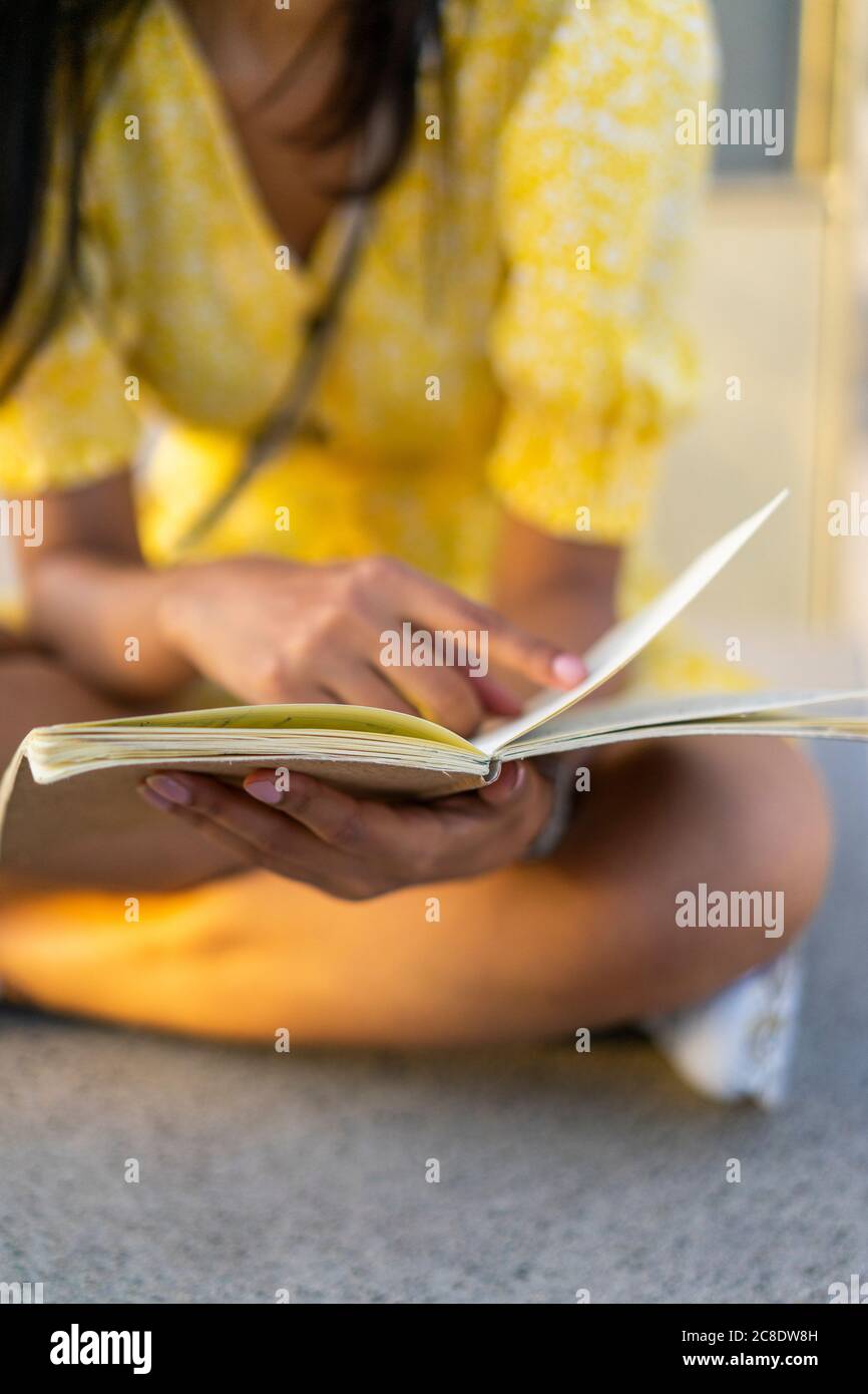 Woman reading paper on bench hi-res stock photography and images - Alamy