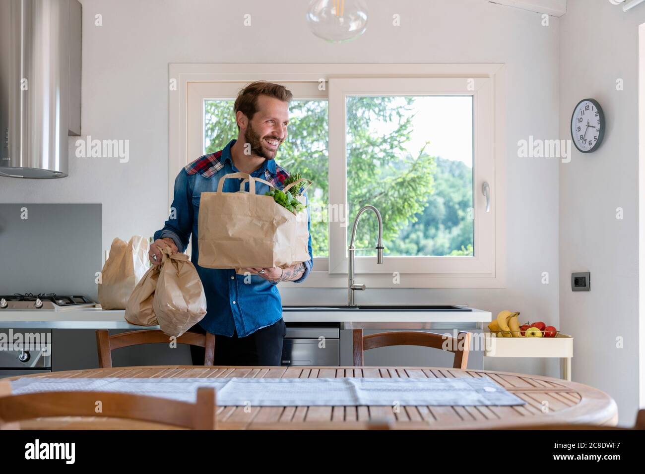 Man holding groceries hi-res stock photography and images - Alamy