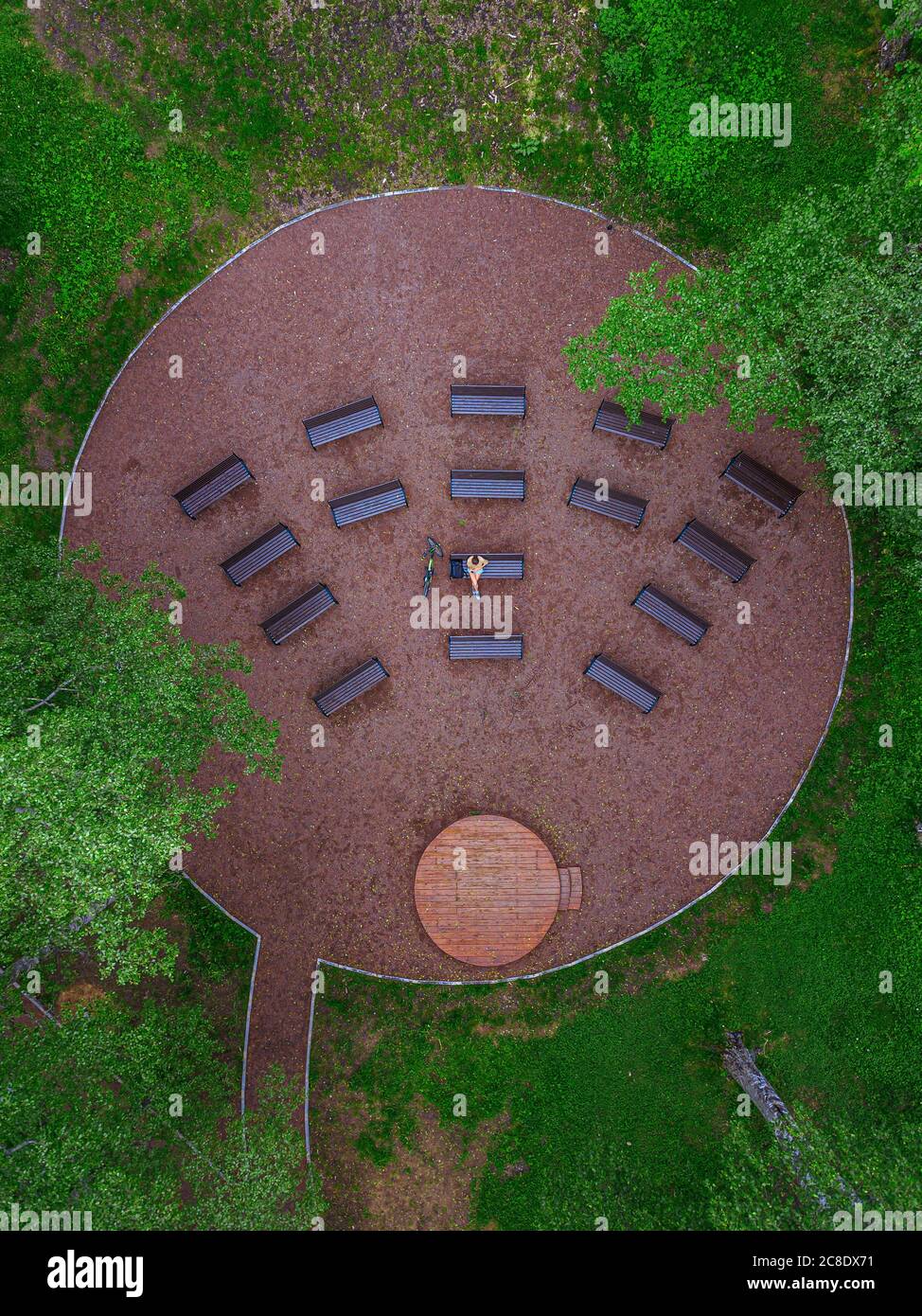 Aerial view of woman relaxing on bench in park Stock Photo - Alamy