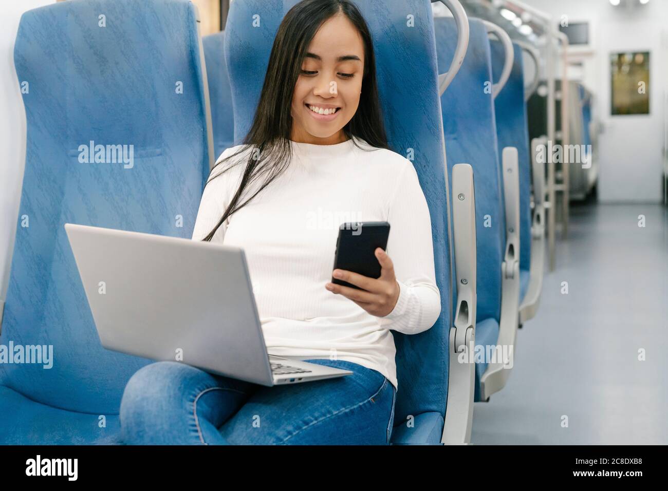 Working on train commuter woman hi-res stock photography and images - Alamy
