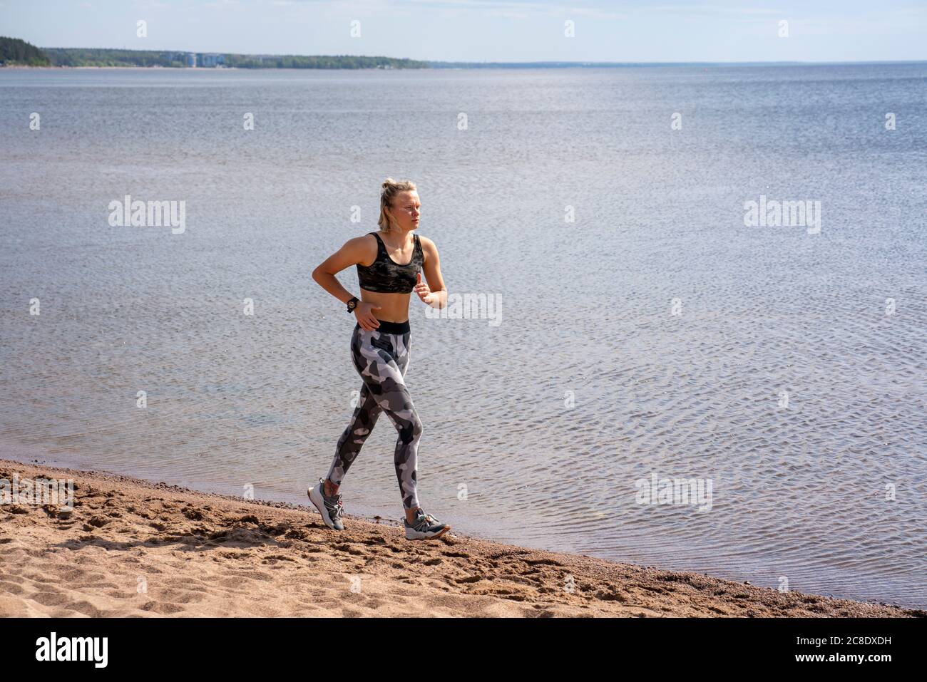 Female jogging exercise beach hi-res stock photography and images - Alamy
