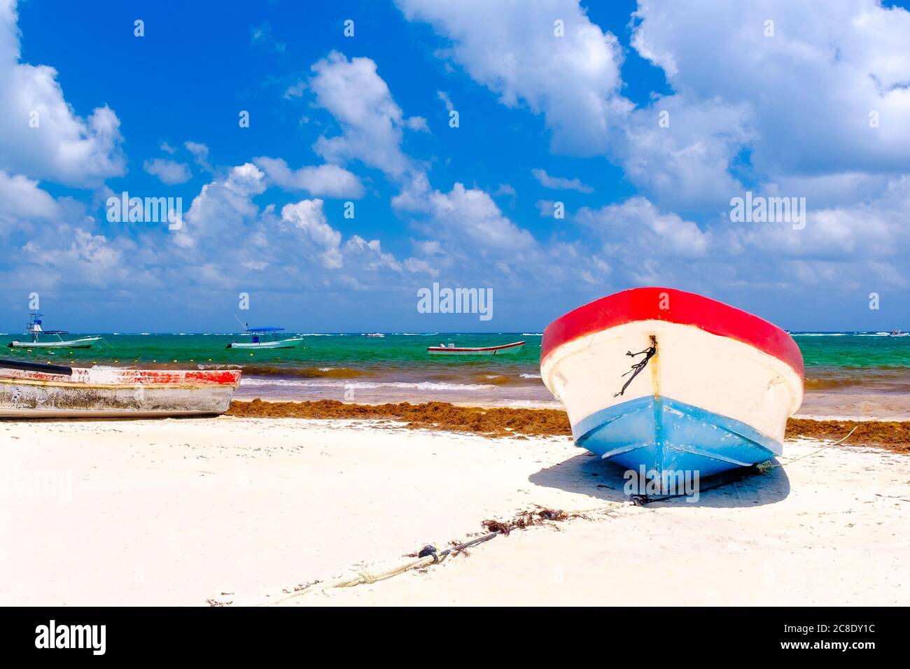 Colorful fishing boats at a beautiful beach on the Mayan Riviera in ...