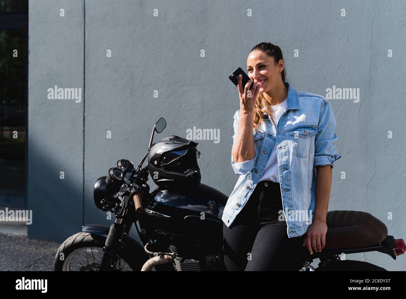 Talking to motorcyclist hi-res stock photography and images - Alamy